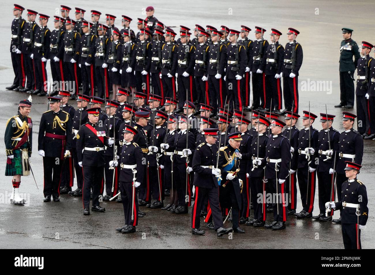 King Charles III (front right) inspects Officer Cadets on parade during ...