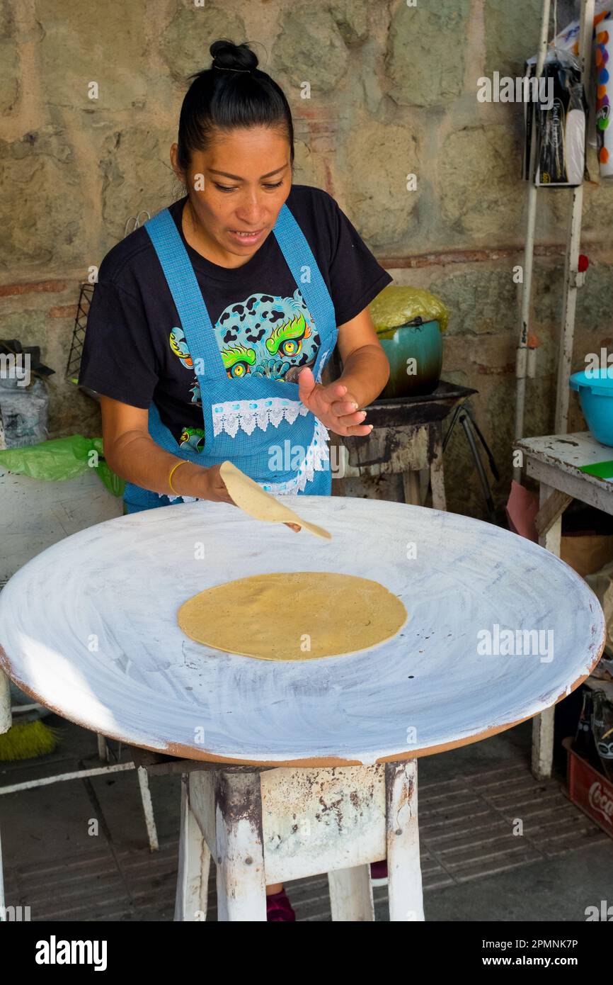 Woman making Tlayudas in a street food stall, Oaxaca city Mexico Stock Photo - Alamy