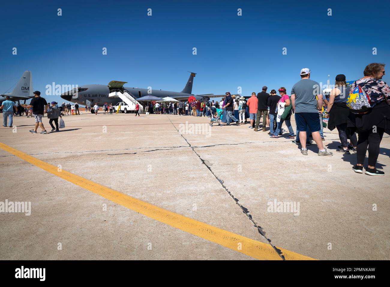 A line of airshow fans waiting to tour an Air Force KC-135 Stratotanker ...