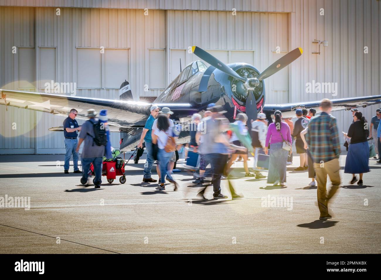 Fans gather around a Grumman F-4F Wildcat on display at the 2023 ...