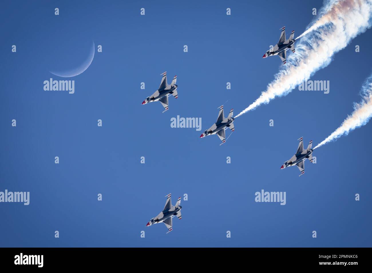 The US Air Force Thunder Birds pass by a visible moon at the 2023 ...
