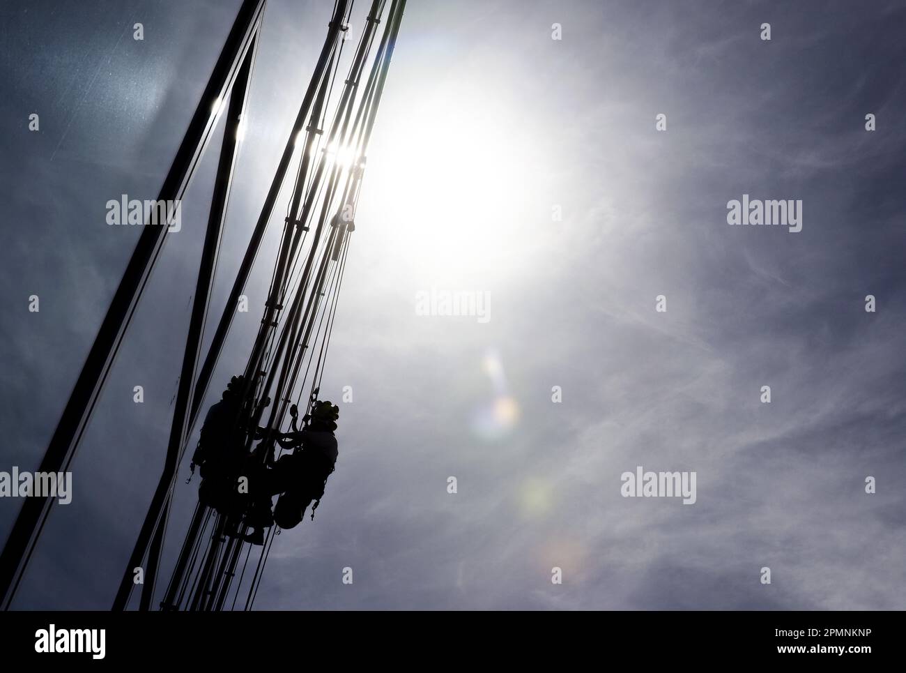 ROTTERDAM - Abseilers hang on the 57th floor of the Rotterdam ...