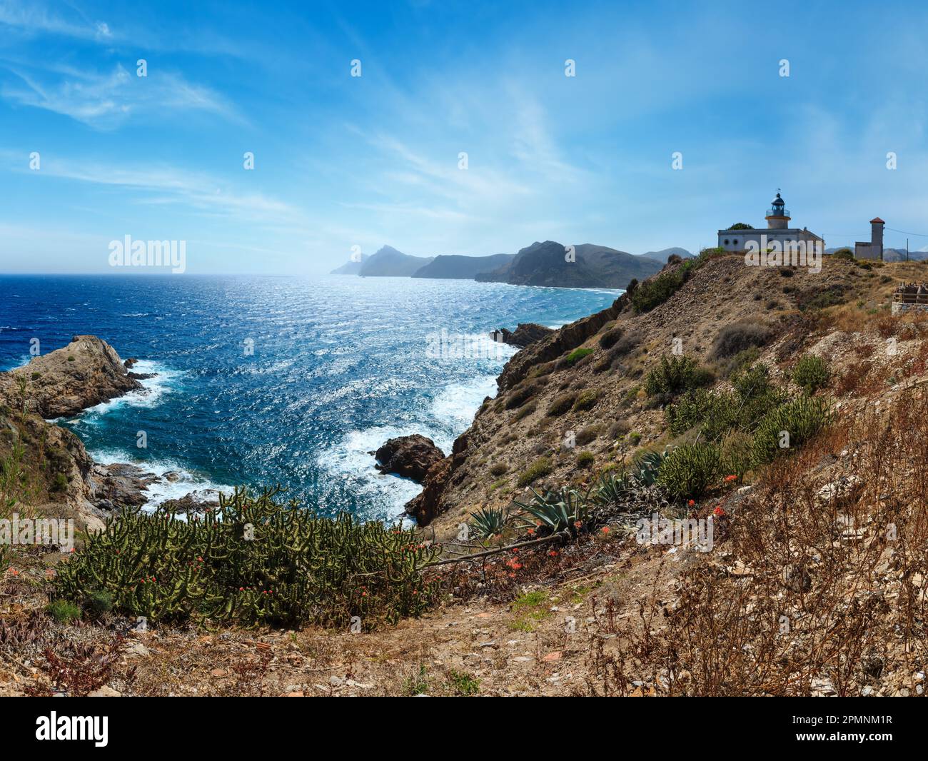 Mediterranean sea summer rocky coast view and lighthouse El hoyo del ...