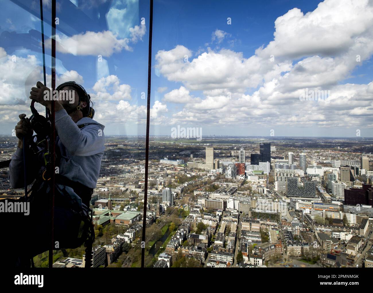 ROTTERDAM - Abseilers hang on the 57th floor of the Rotterdam ...