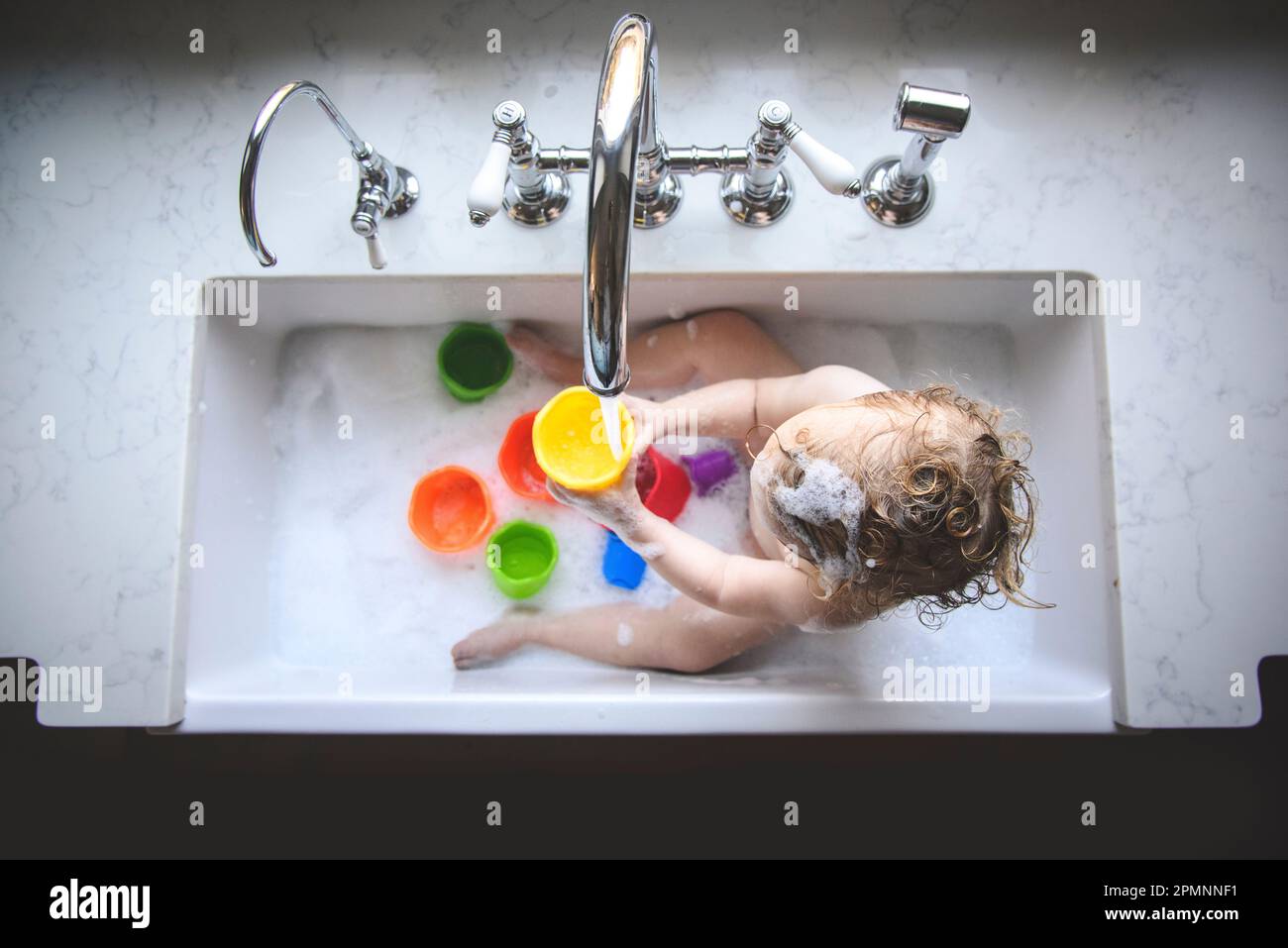 Baby in bubble bath hi-res stock photography and images - Alamy