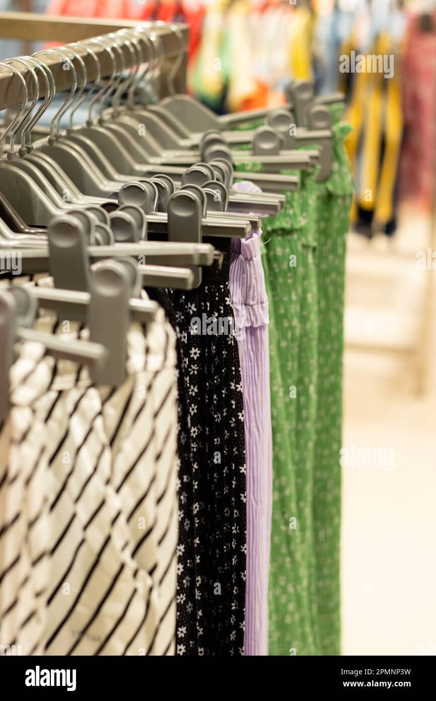 Hanging from hangers hi-res stock photography and images - Alamy
