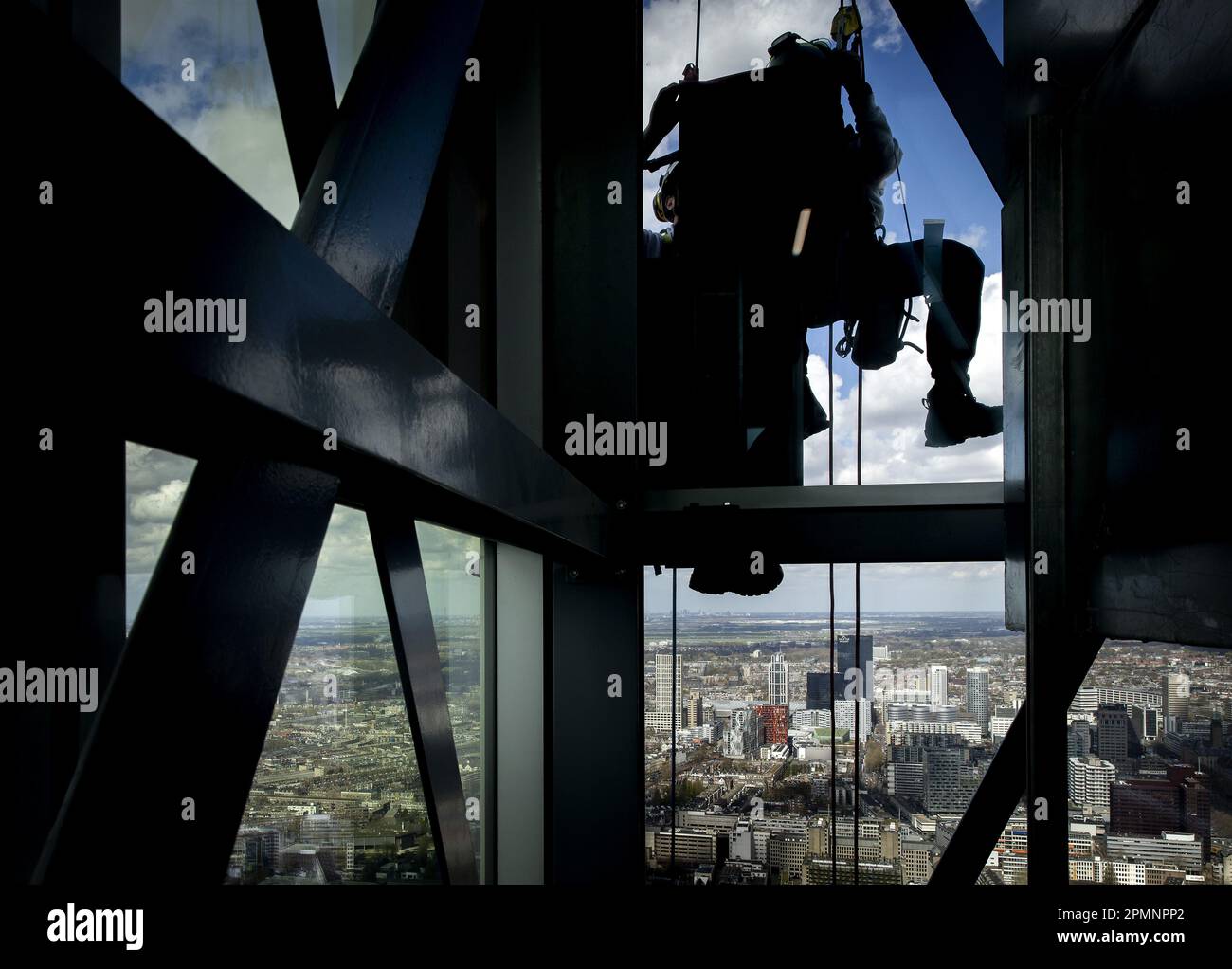 ROTTERDAM - Abseilers hang on the 57th floor of the Rotterdam ...