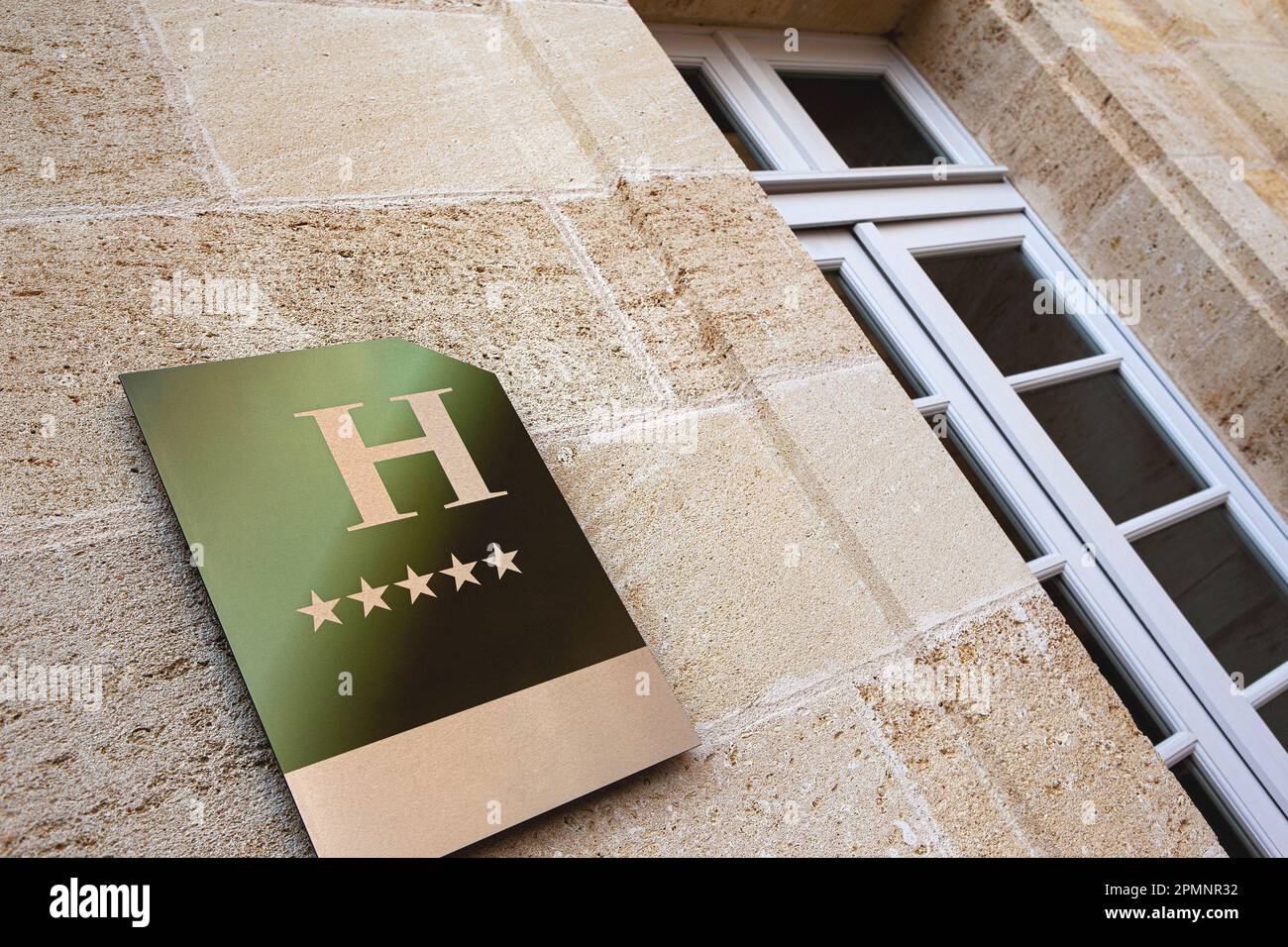Five stars hotel sign on a stone wall Stock Photo - Alamy