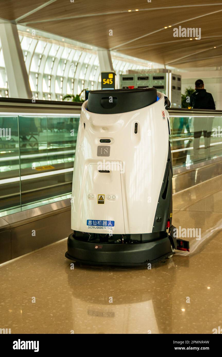 A Scrubber 50 autonomous robot cleaner at work in Guangzhou Airport ...