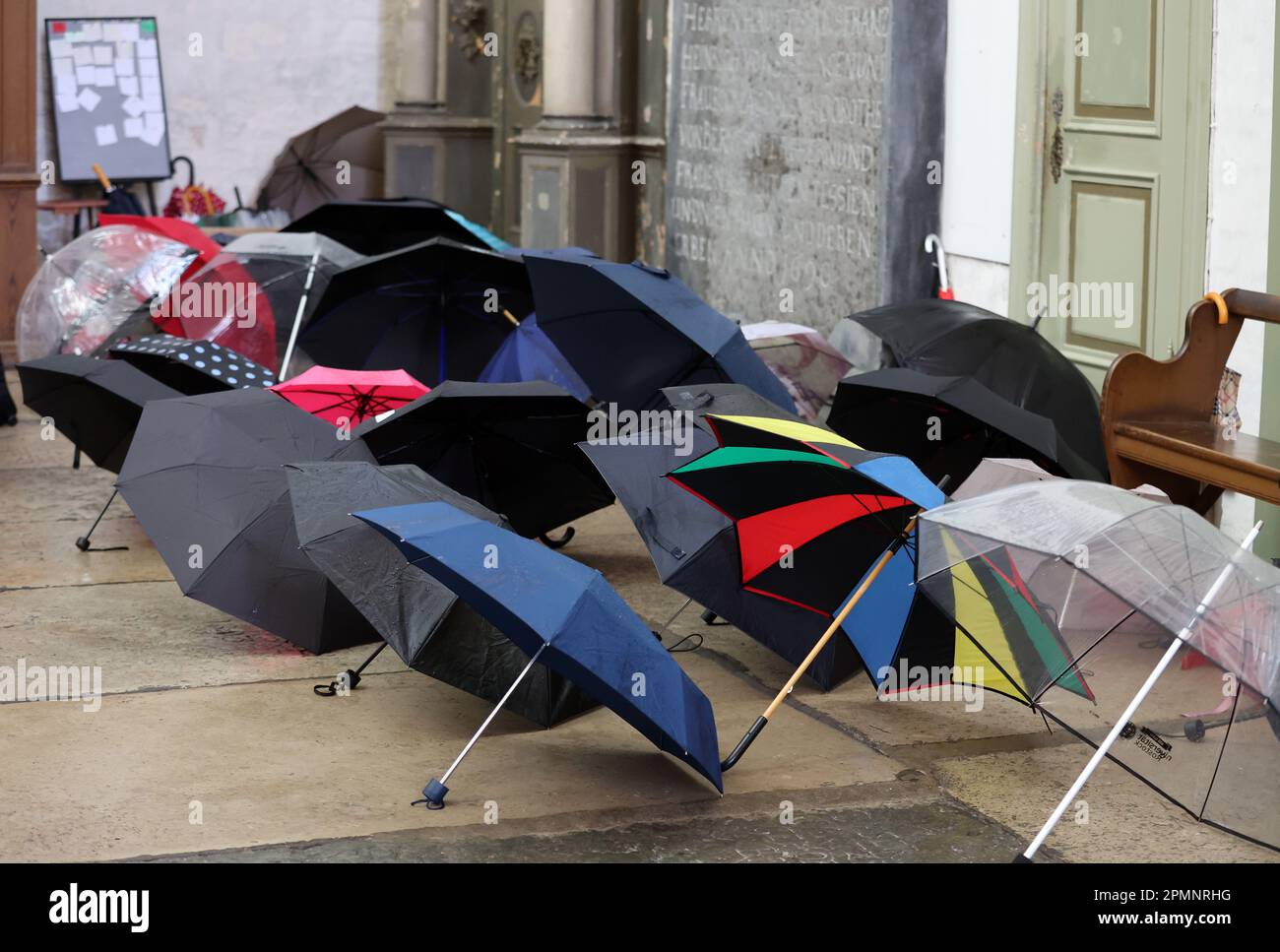 Rostock, Germany. 14th Apr, 2023. Stretched umbrellas stand in the ...