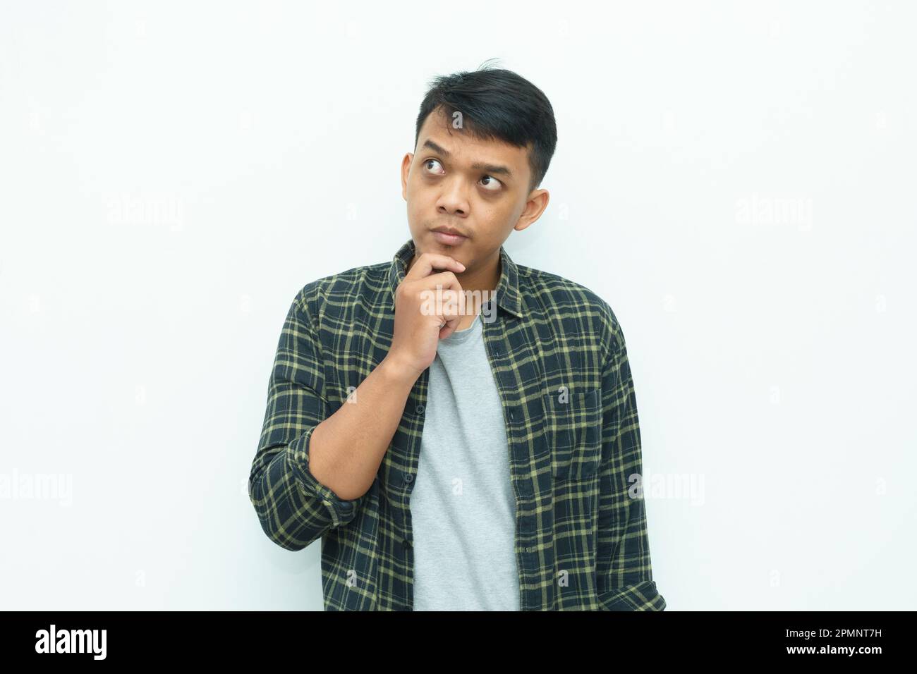 Man curious thinking hand gesture hi-res stock photography and images ...