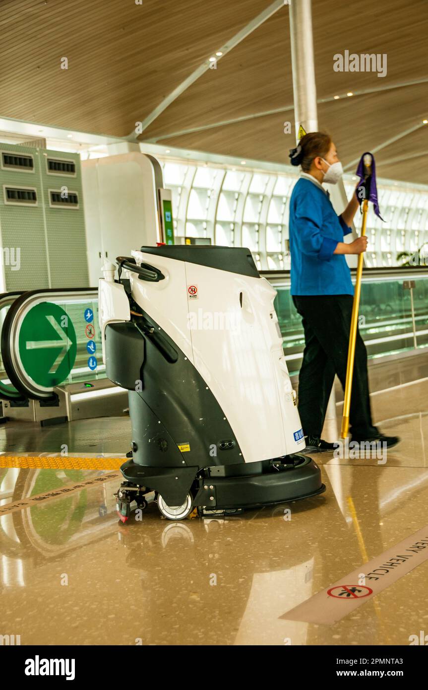 A Gaussian Robotics Scrubber 50 autonomous robot cleaner and a real ...