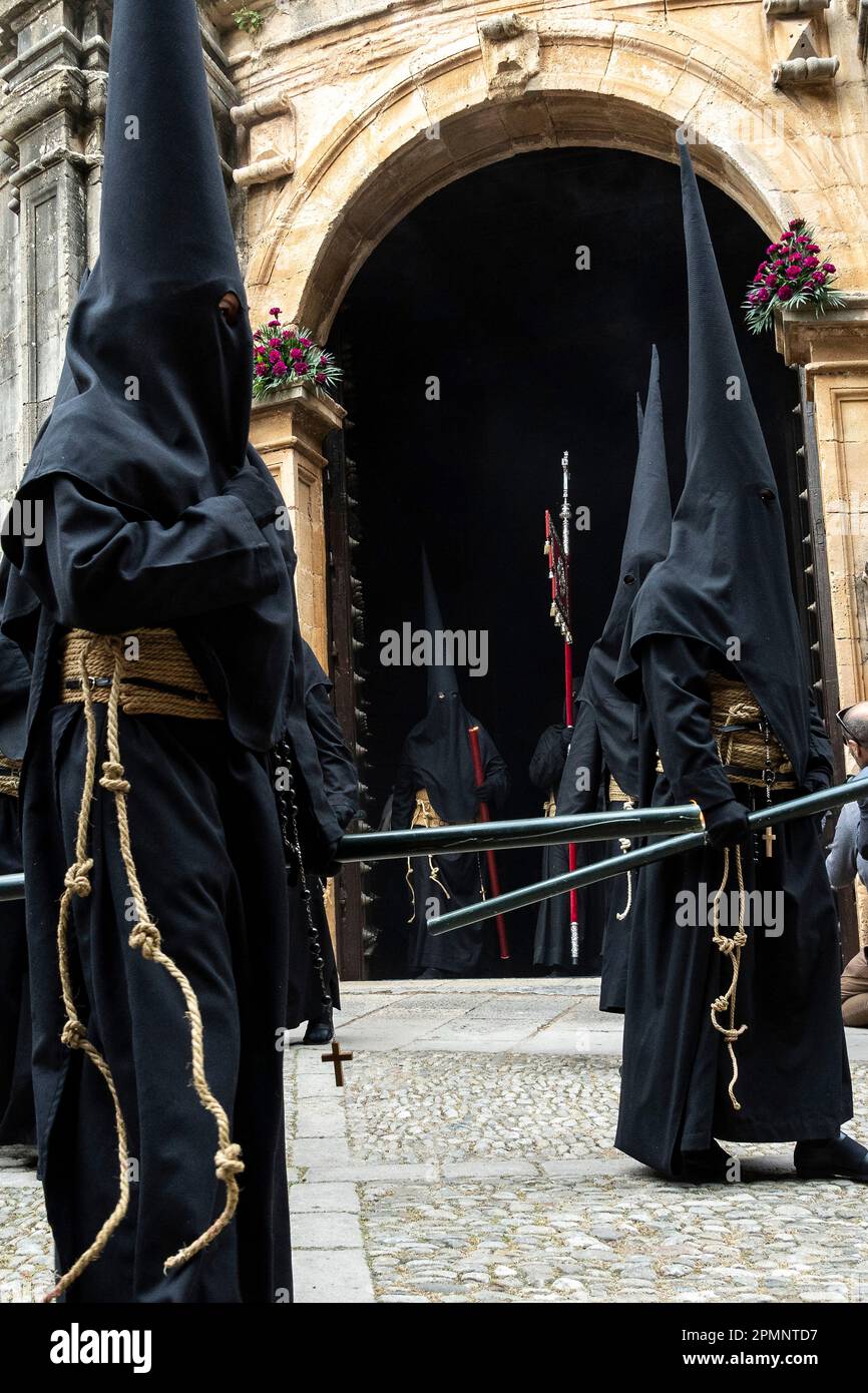 Penitents wearing black cone shaped hoods depart from the St. Mary ...