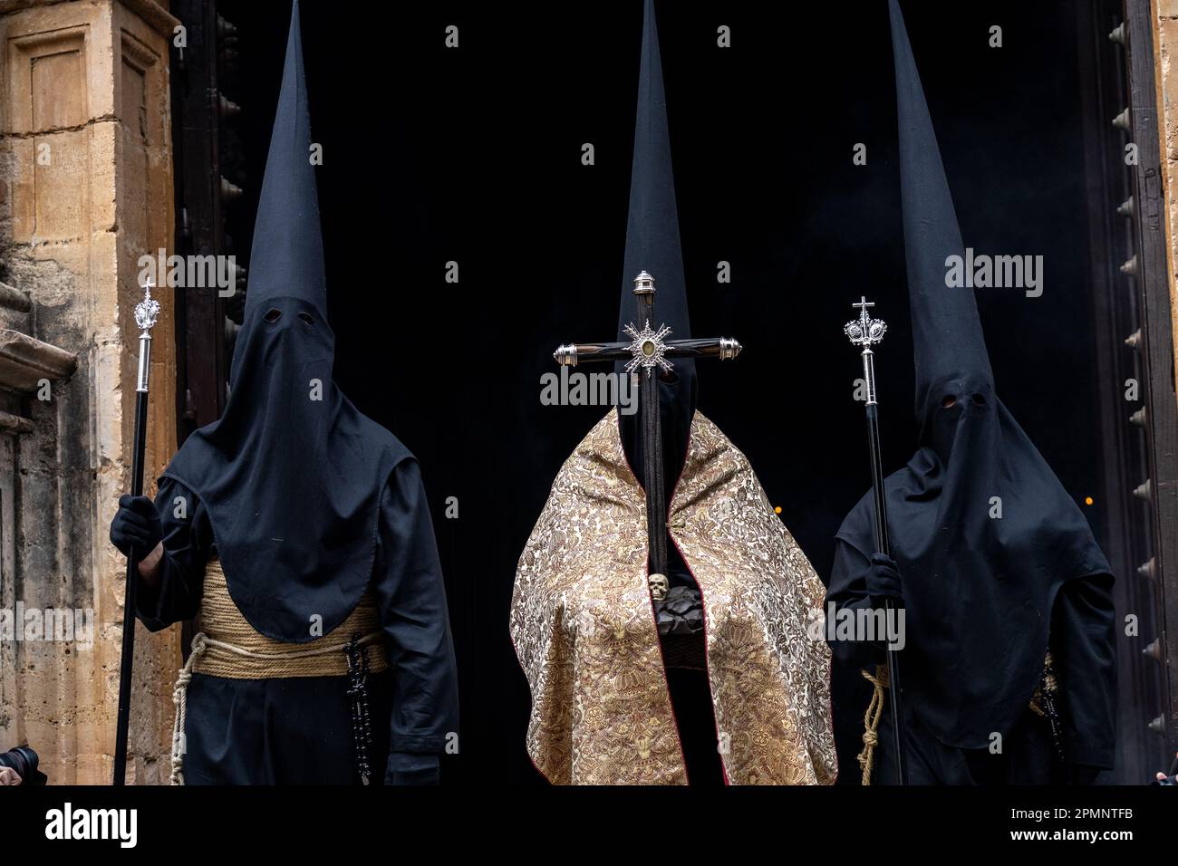 Penitents wearing black pointed hoods process from St. Mary Major ...