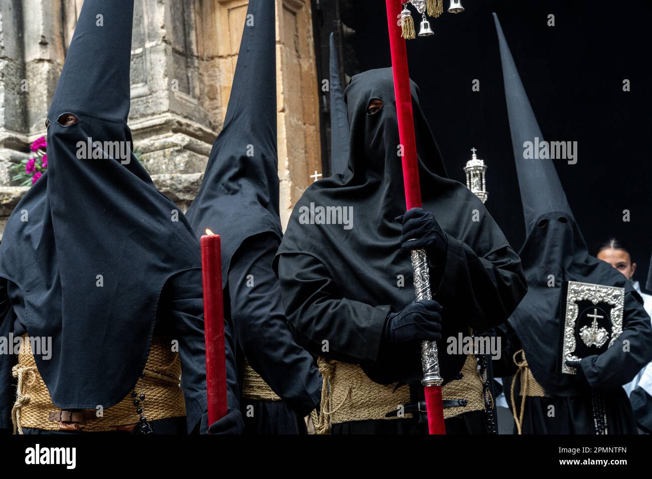 Penitents wearing black pointed hoods process from St. Mary Major ...