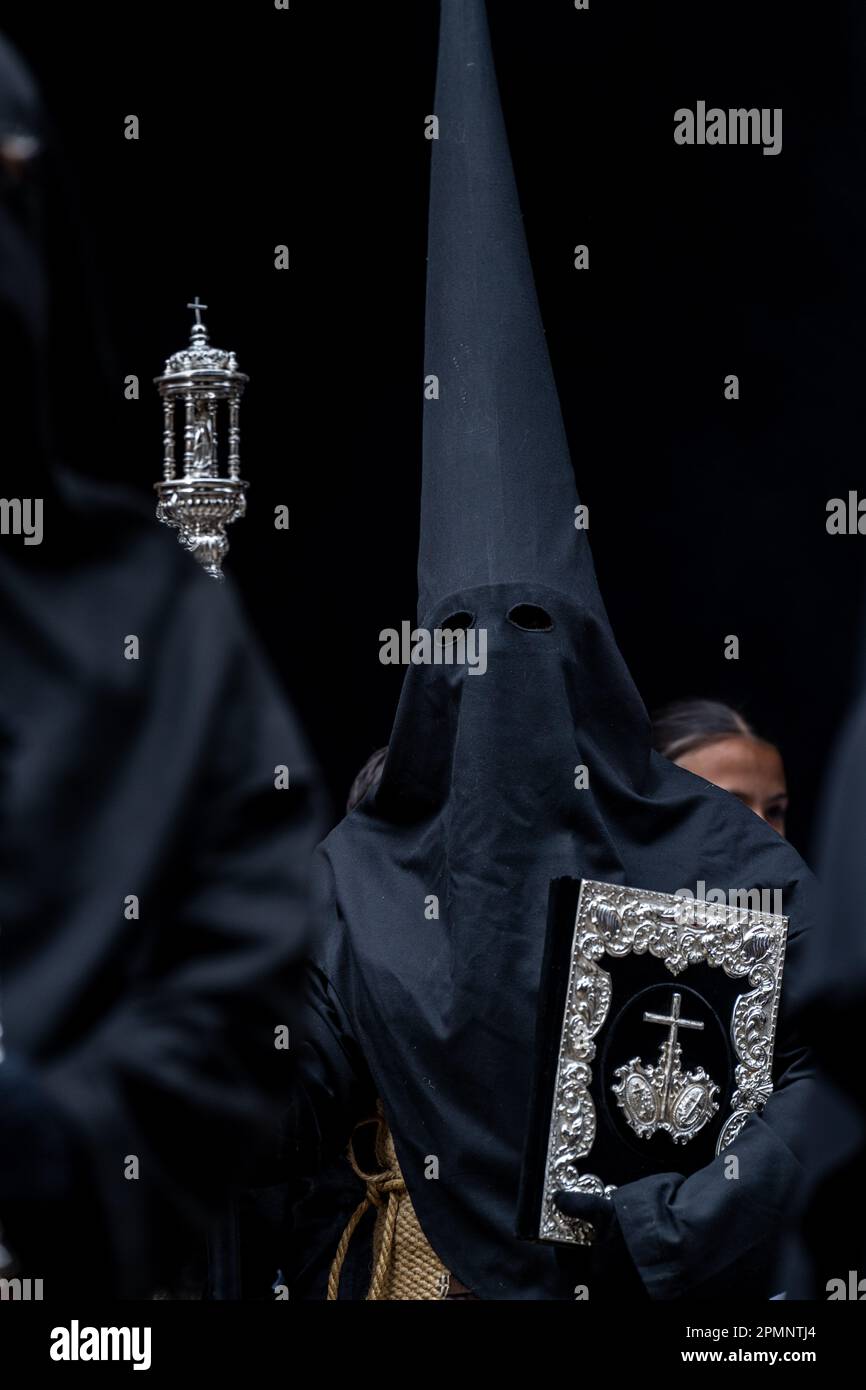 Penitents wearing black pointed hoods process from St. Mary Major ...