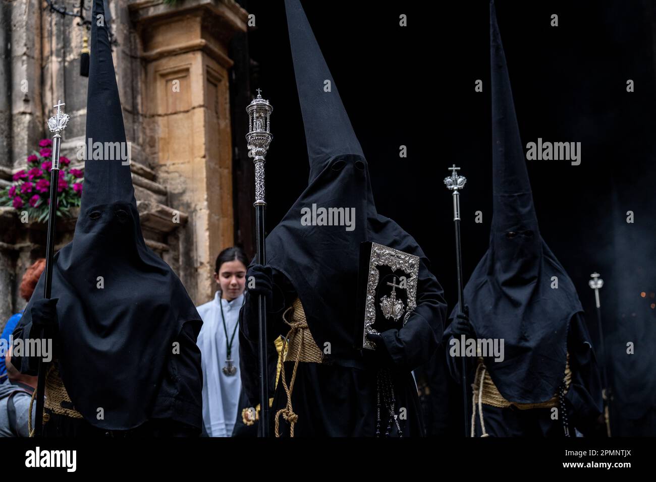 Penitents wearing black pointed hoods process from St. Mary Major ...