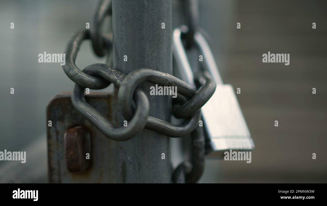 Gate fence Lock protection at security industrial place Stock Photo - Alamy