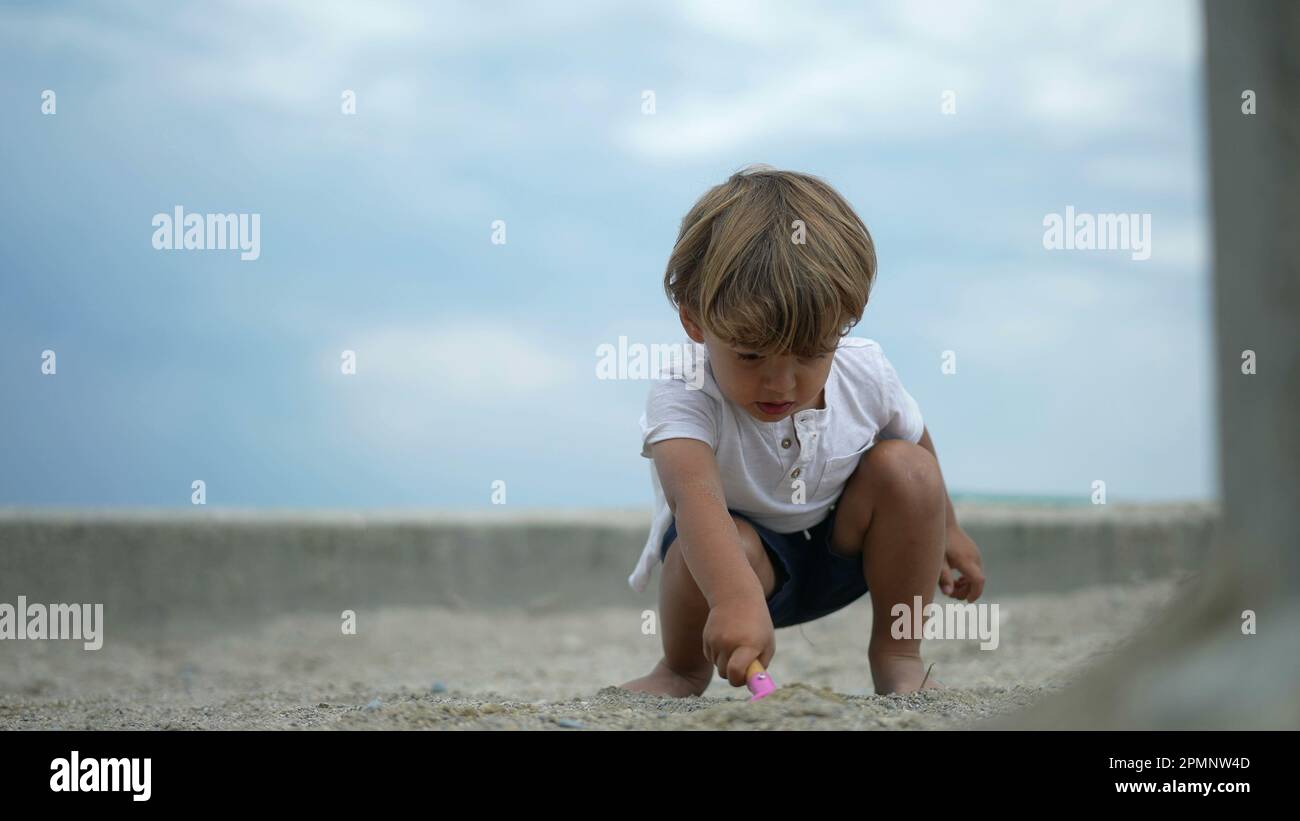 Kid having fun in sand hi-res stock photography and images - Alamy