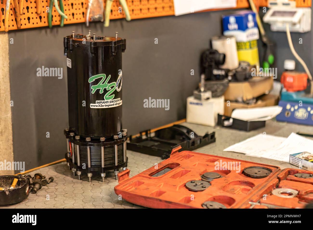 Milan, Italy 11 april 2023: Close-up of a mechanic installing a ...