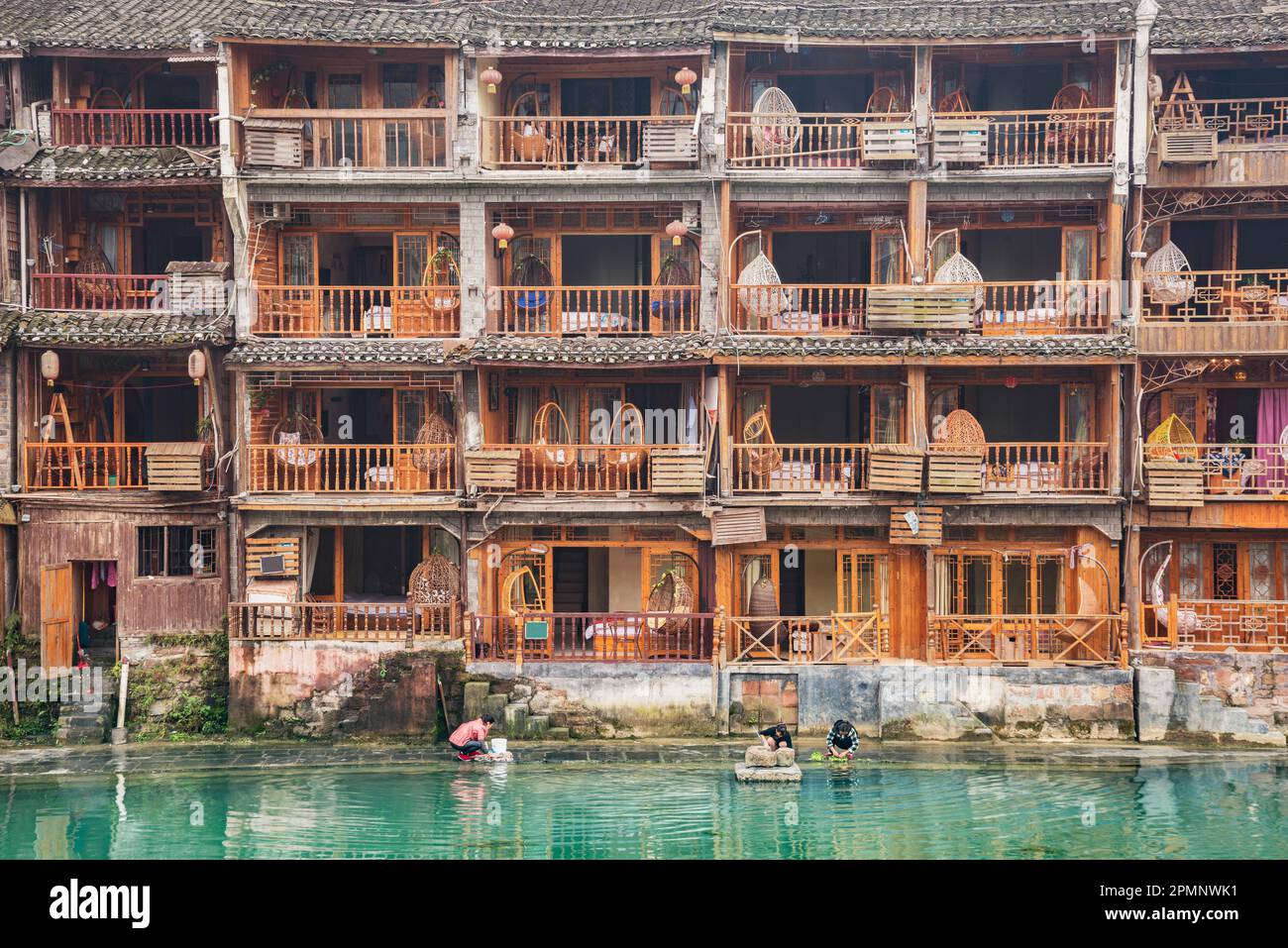 Ancient wooden house by the river. Fenghuang. China Stock Photo - Alamy