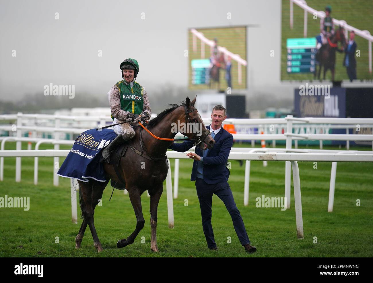 Ben Harvey celebrates winning thethe William Hill Handicap Hurdle on ...