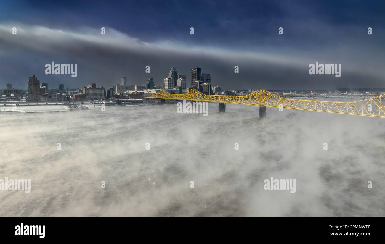 A drone view of Louisville and River Ohio covered in the fog on a ...