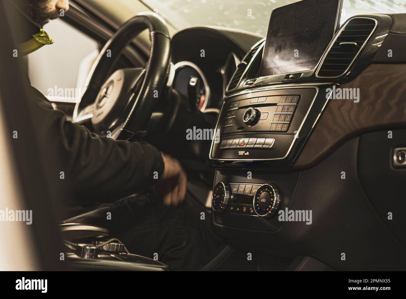 Milan, Italy 11 april 2023: A skilled mechanic carefully examining the ...