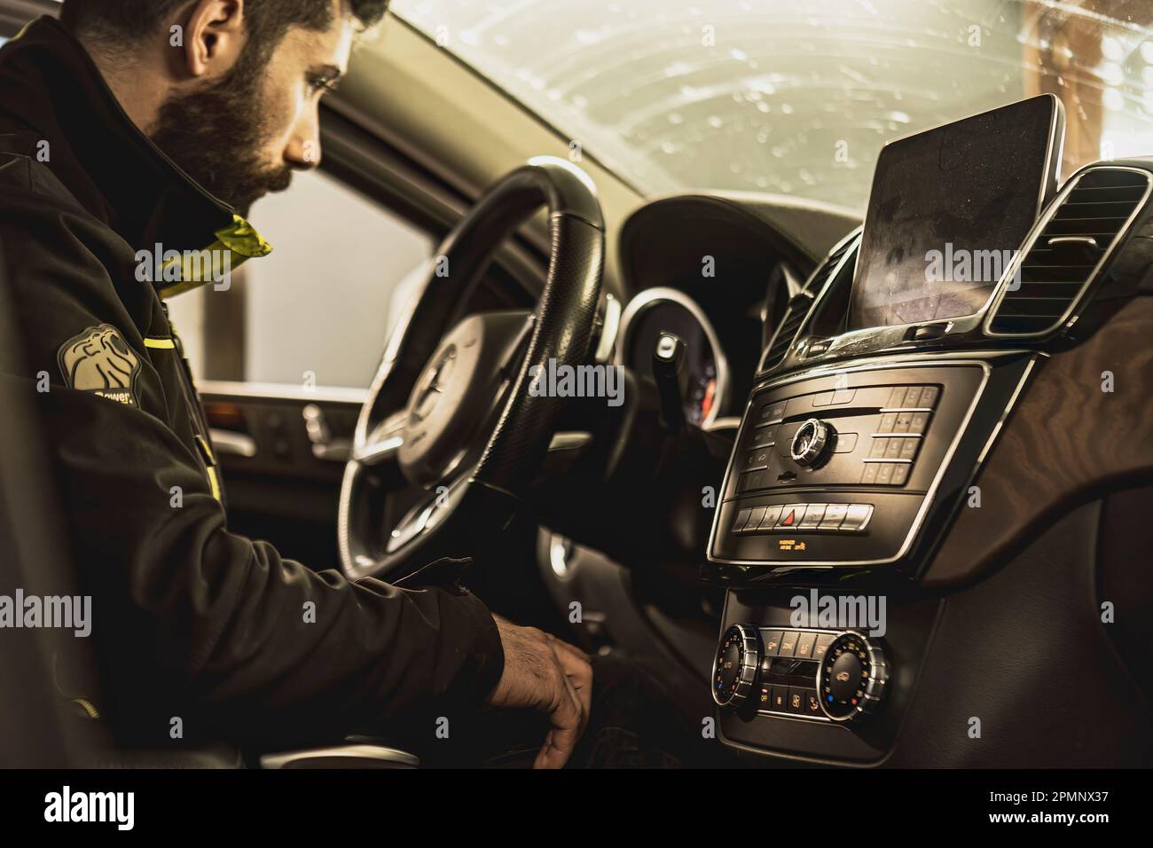 Milan, Italy 11 april 2023: A skilled mechanic carefully examining the ...