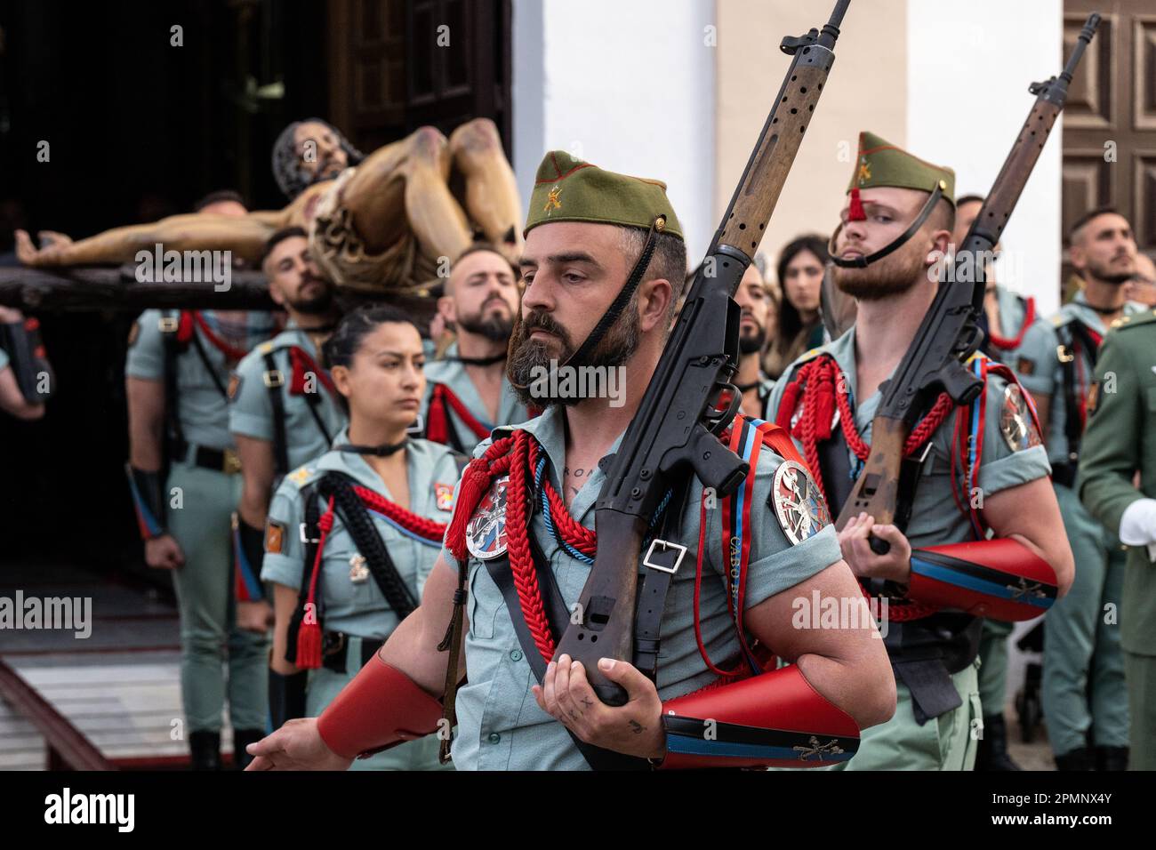 Members of the Spanish Foreign Legion carry a statue of Jesus Christ on ...