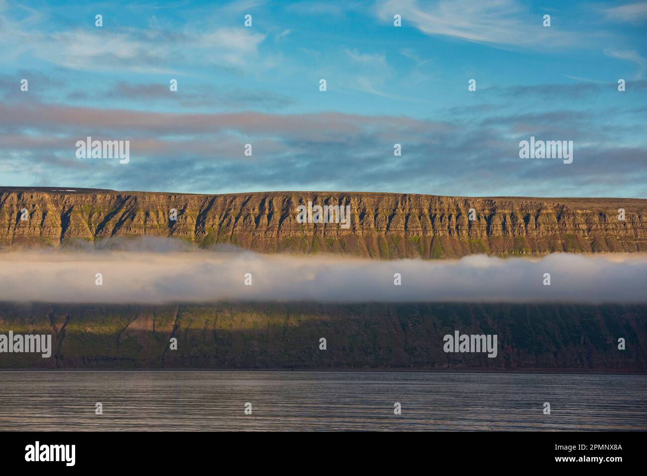 Sunrise on the flood basalt cliffs near Vigur Island, Iceland; Iceland ...