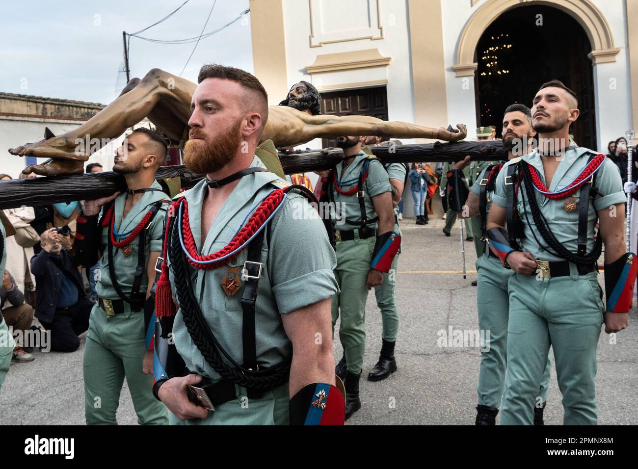 Members of the Spanish Foreign Legion carry a statue of Jesus Christ on ...