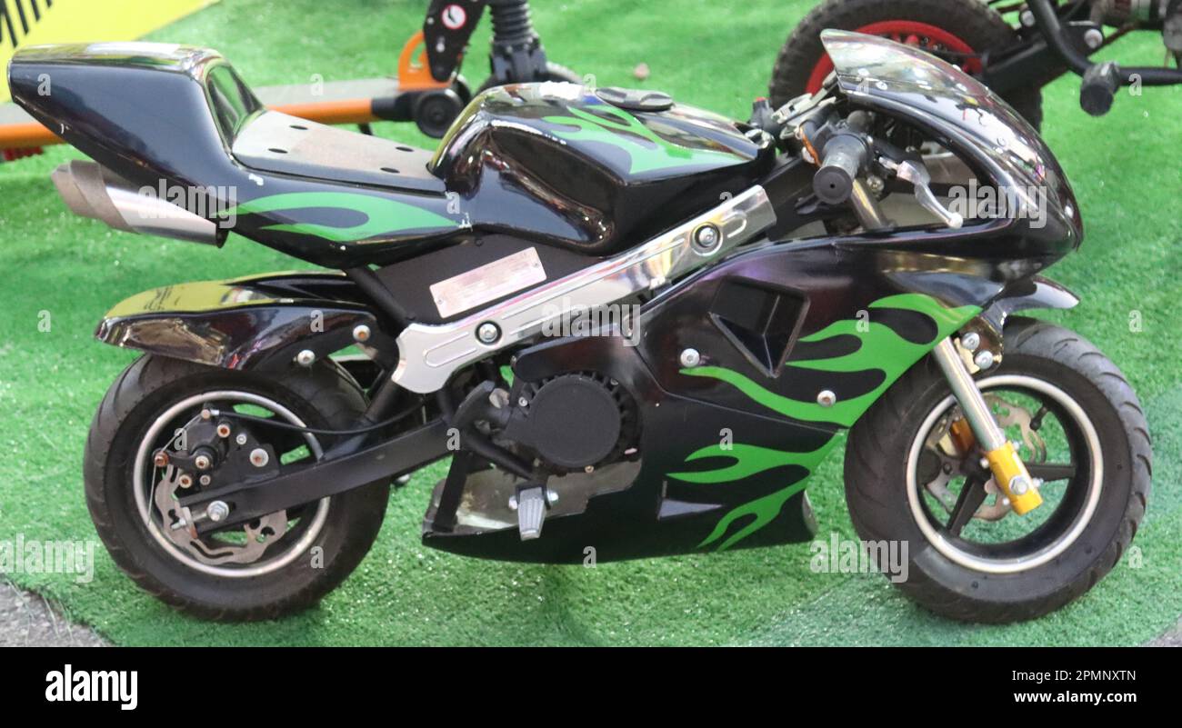 A high-resolution, close-up shot of a miniature toy motorcycle, with ...