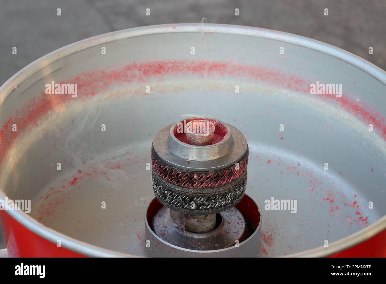 An image of an unplugged cotton candy machine, with its colorful red ...