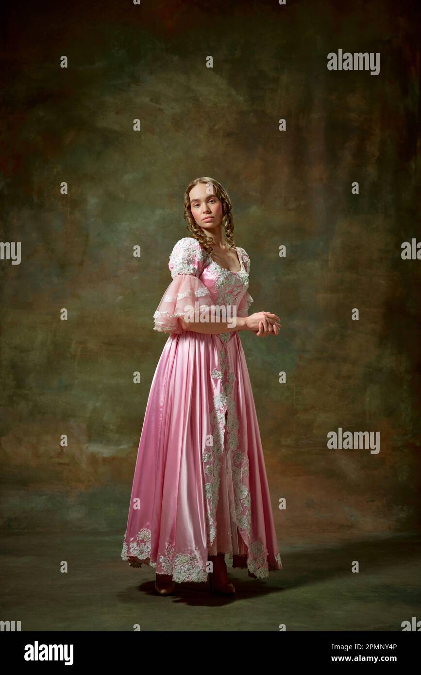 Portrait of beautiful blond girl, princess wearing fancy pink dress and ...