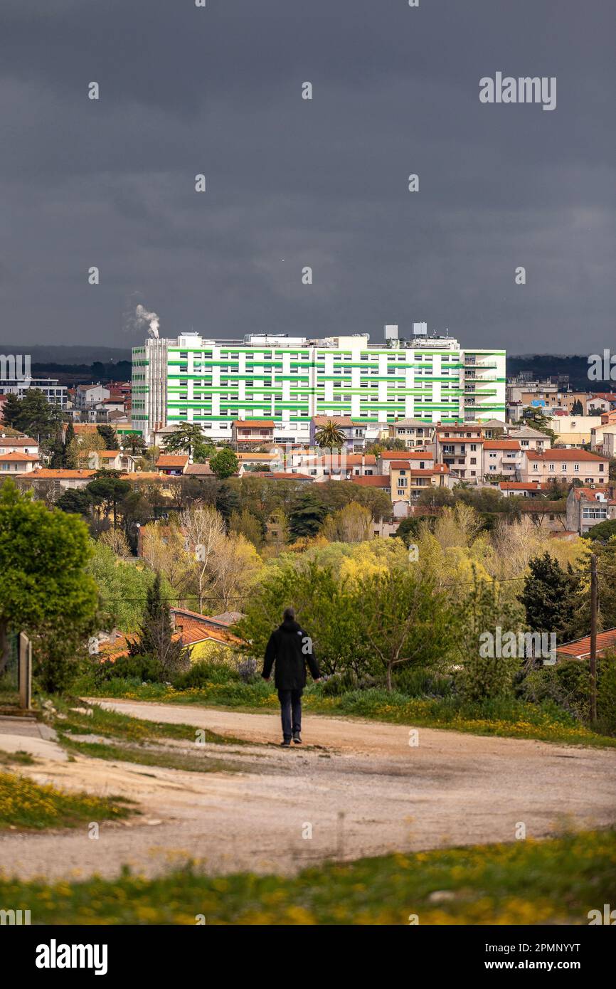 The sky covered with dark rain clouds over the city of Pula, Croatia on ...