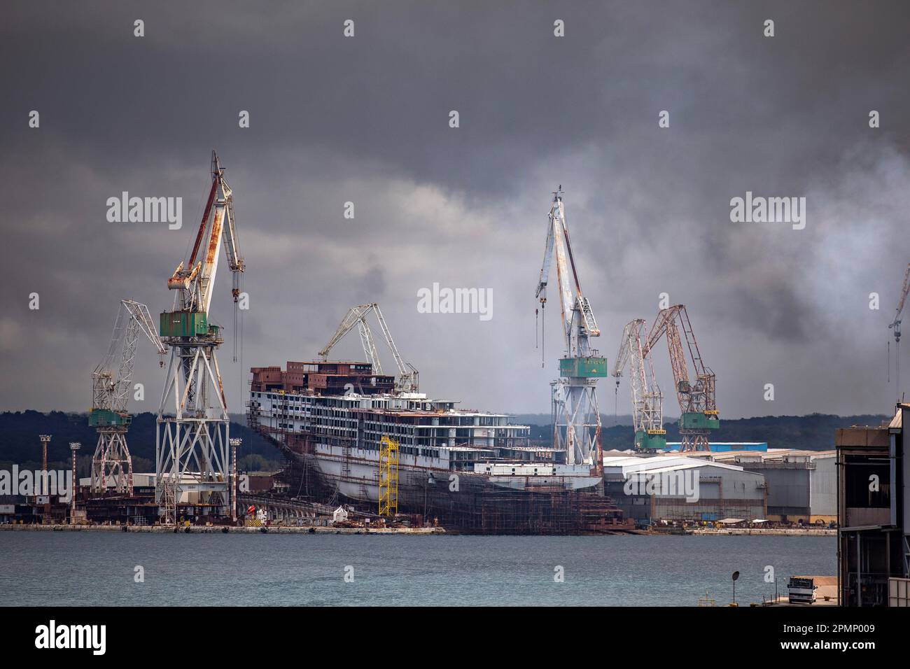 The sky covered with dark rain clouds over the city of Pula, Croatia on ...