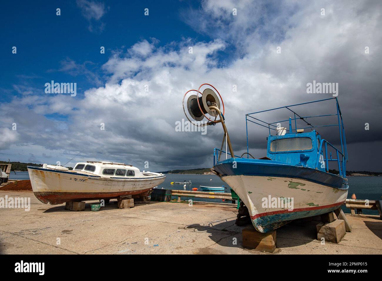 The sky covered with dark rain clouds over the city of Pula, Croatia on ...