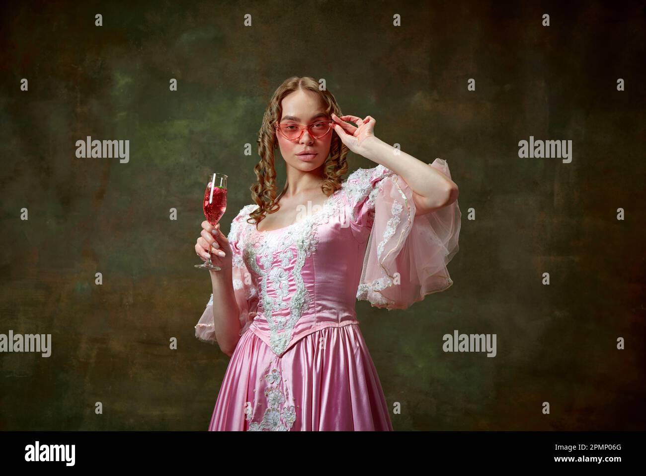 Portrait of beautiful blond princess wearing pink dress and sunglasses ...