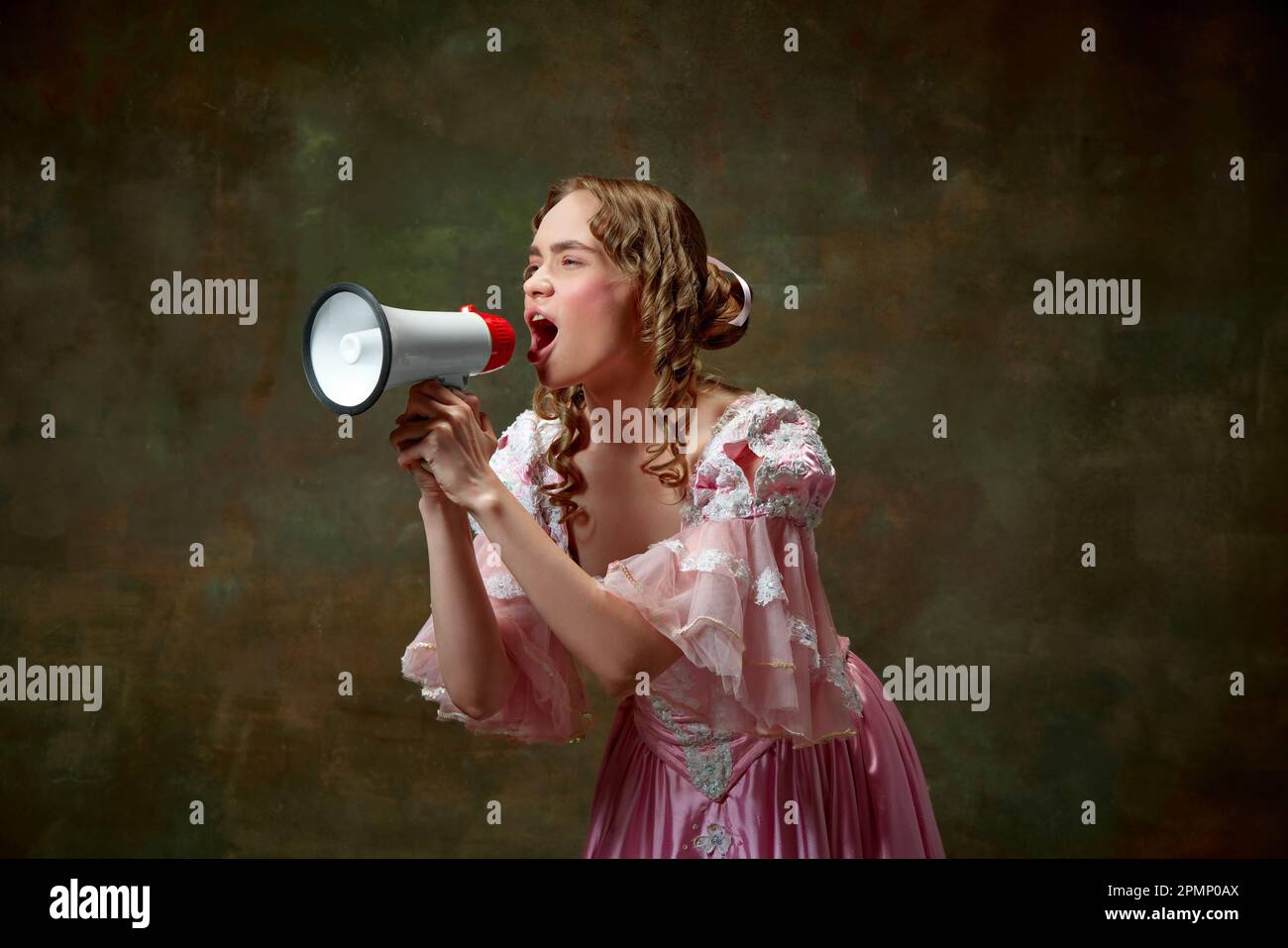 One adorable blond princess wearing fancy pink dress shouting through ...
