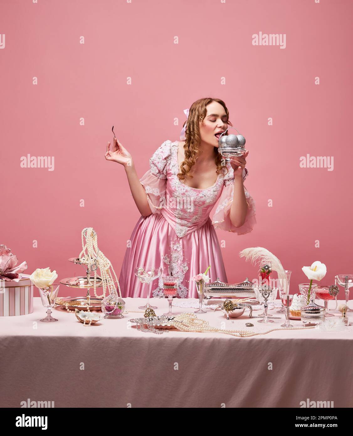 Fairy tale blond princess wearing renaissance dress standing near the ...