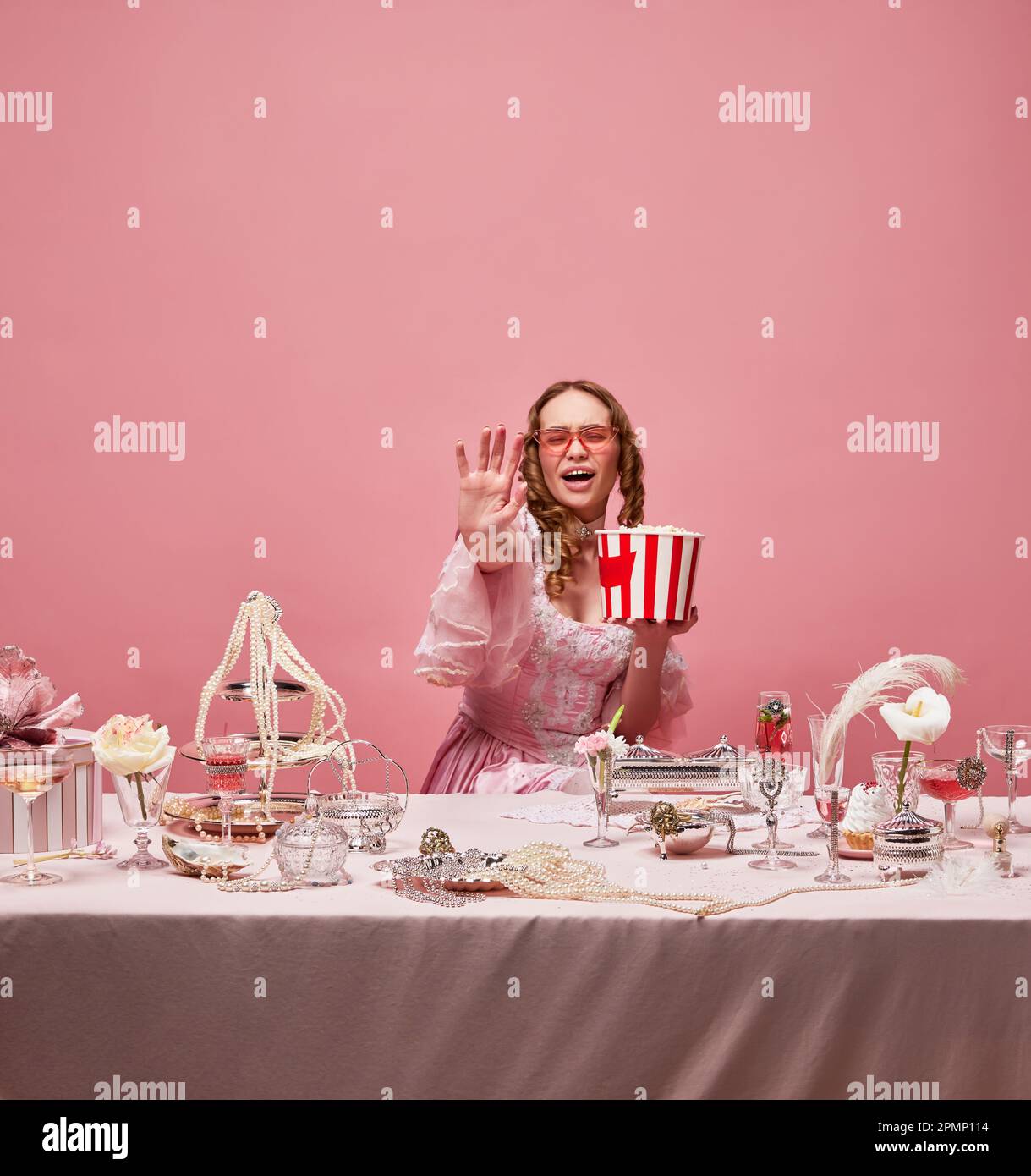 Fairy tale blond princess wearing renaissance dress and sunglasses ...