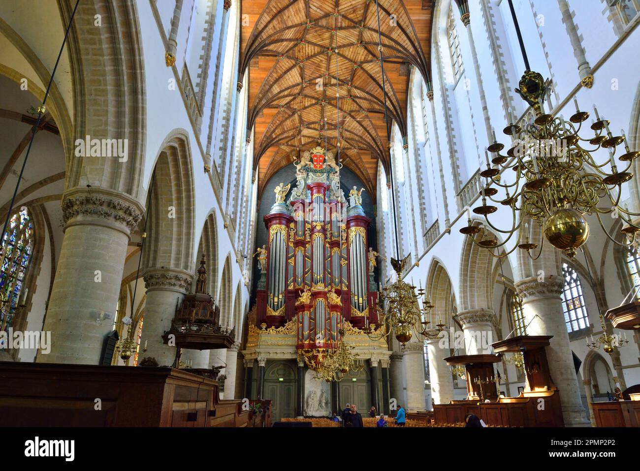 Interior of Gothic St.Bavo Church orThe Grote Kerk with ornate ribbed ...