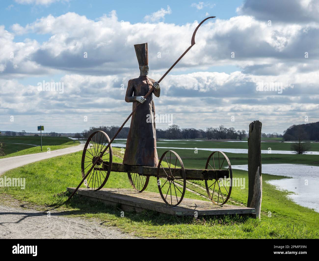 Sculpture on dike at River Elbe, Mödlich, ferryman bringing people to ...