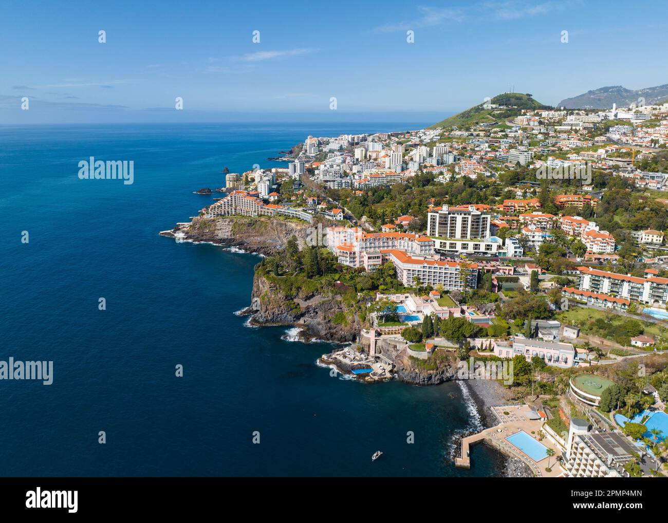 An aerial view of a luxury resort and beach in Funchal, Madeira Island ...