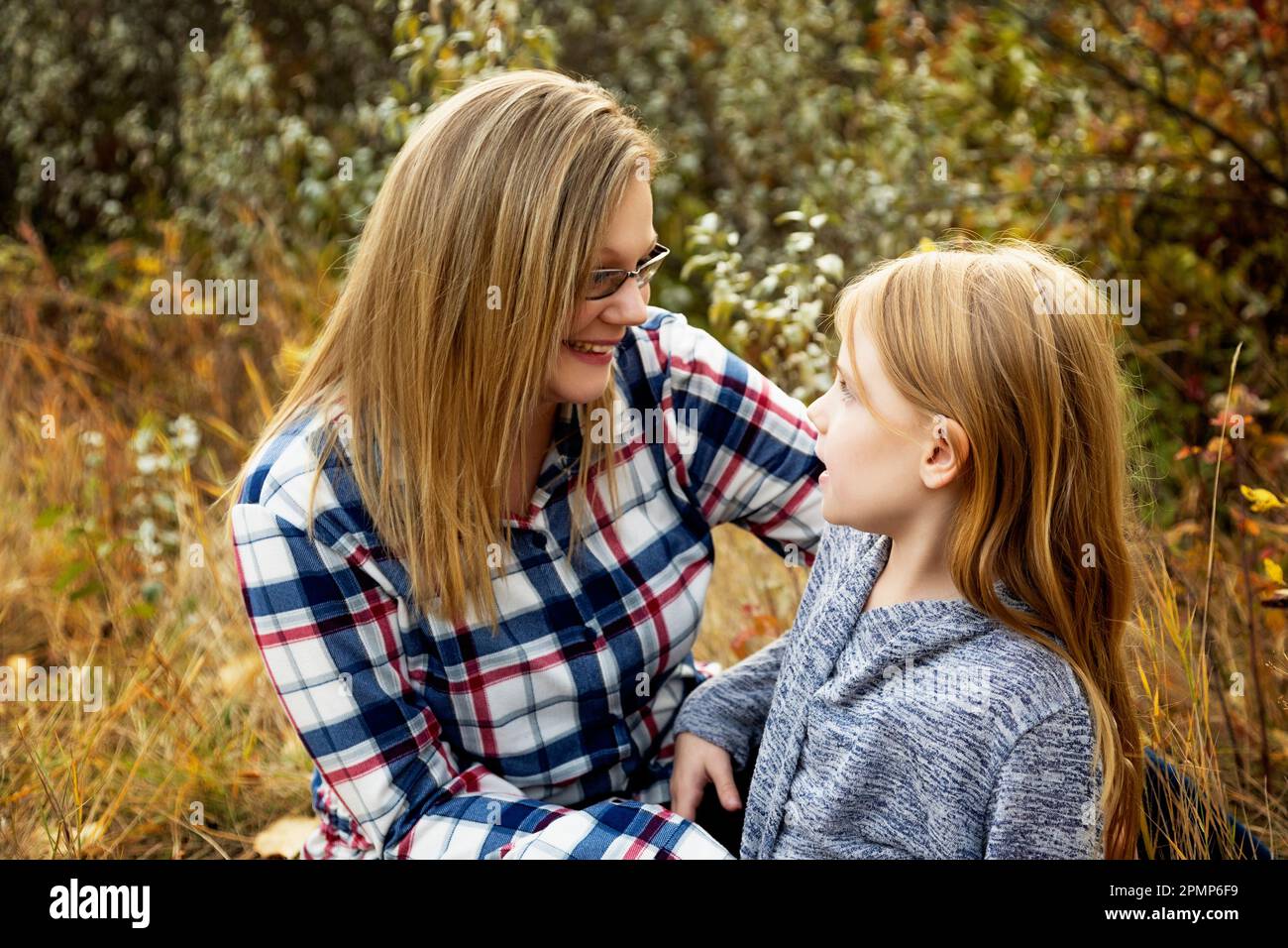 Two mothers talking children hi-res stock photography and images - Alamy