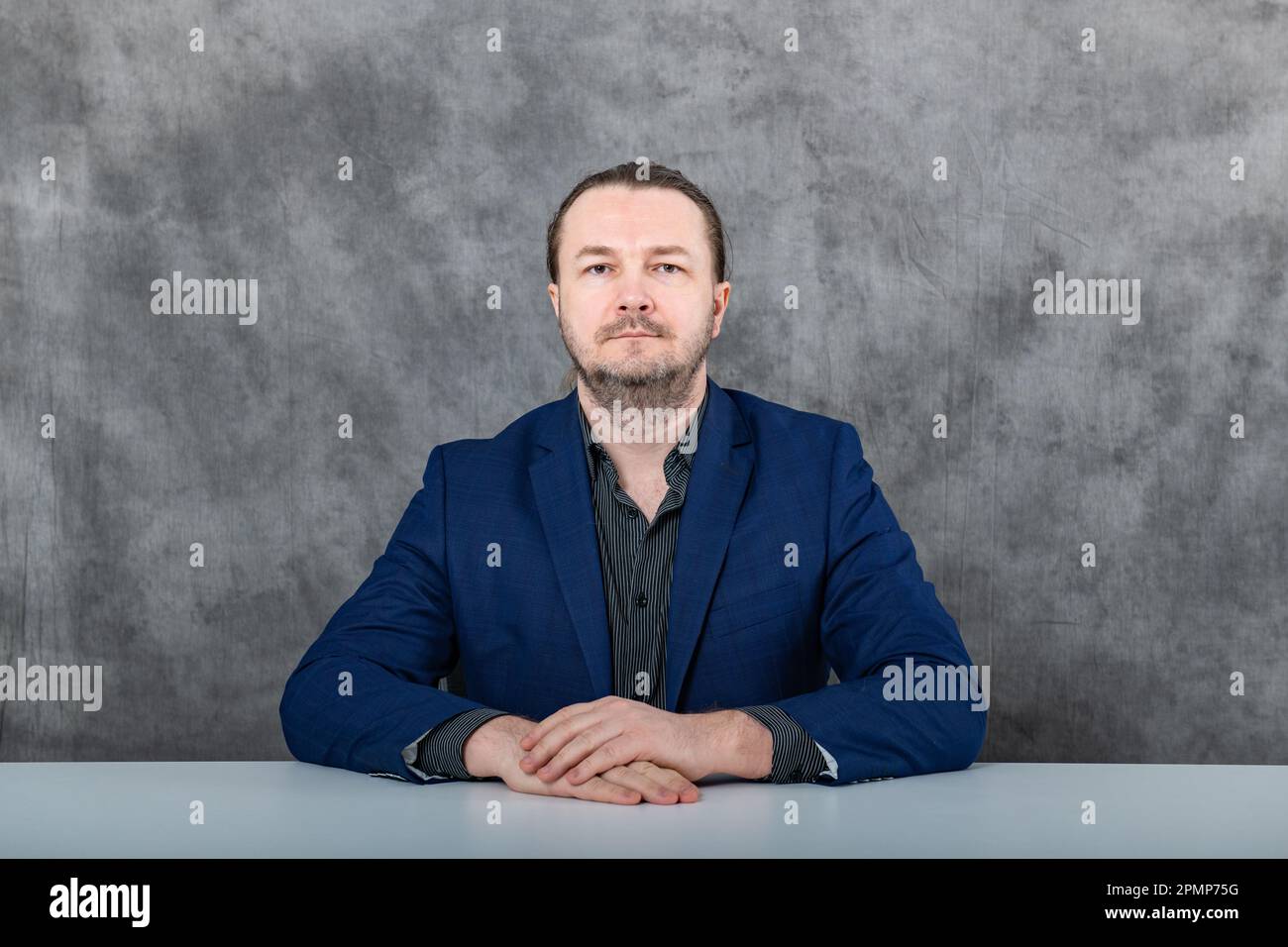 Business man sits table hi-res stock photography and images - Alamy