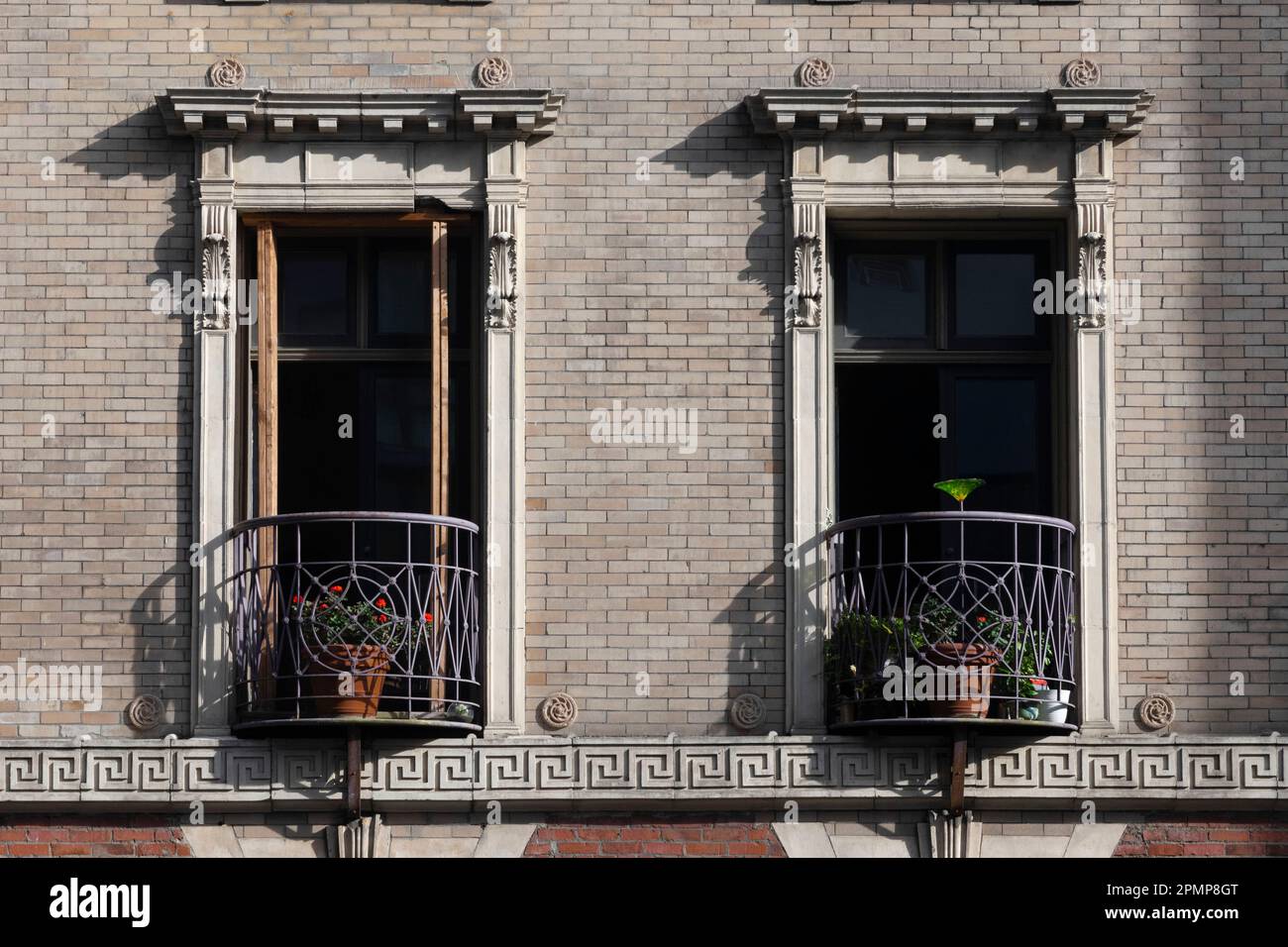 Decorative balconies on a residential building. The wrapped wrought ...