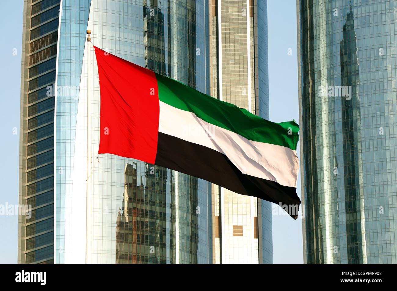 united arab emirates (uae) national flag waves on air in the sky Stock ...