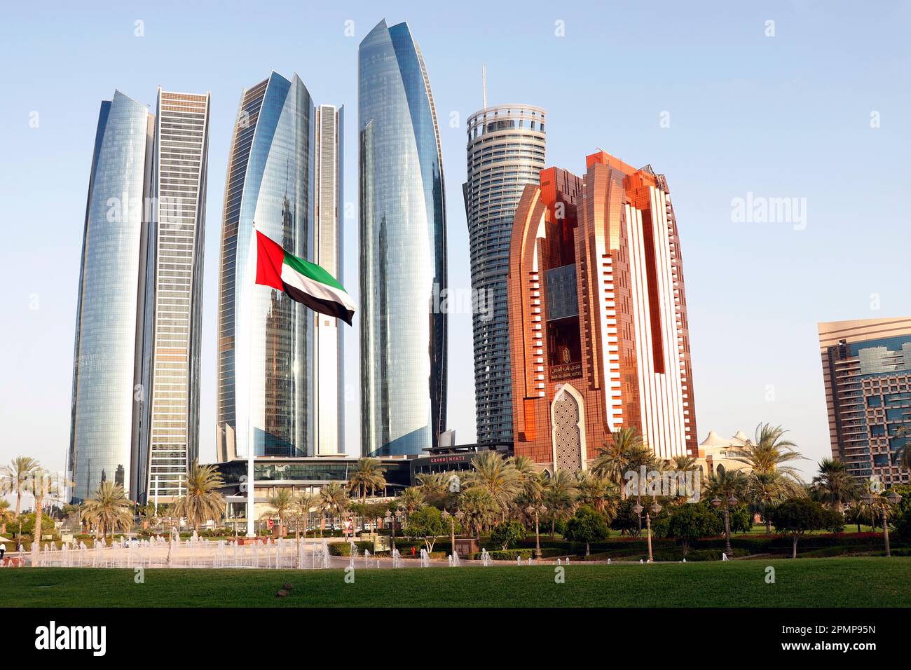 united arab emirates (uae) national flag waves on air in the sky in ...